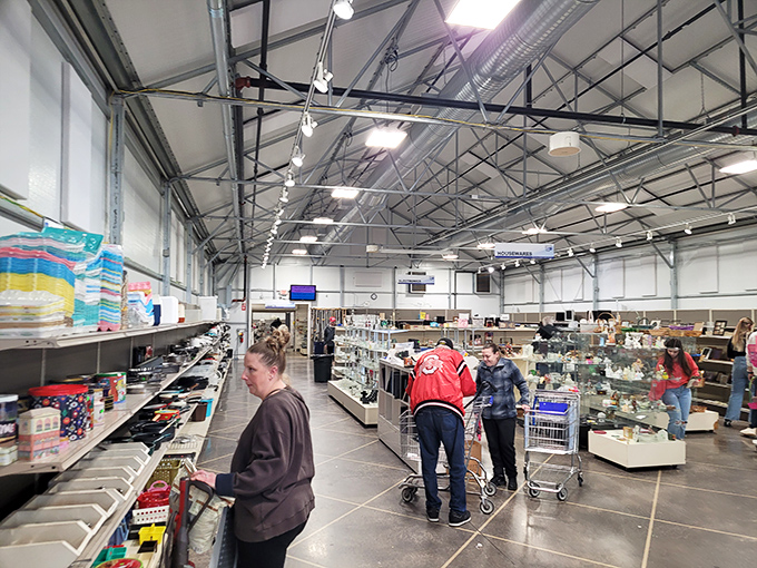 The warehouse-sized space buzzes with bargain hunters pushing carts filled with discoveries. Every aisle promises potential treasures waiting to be uncovered.