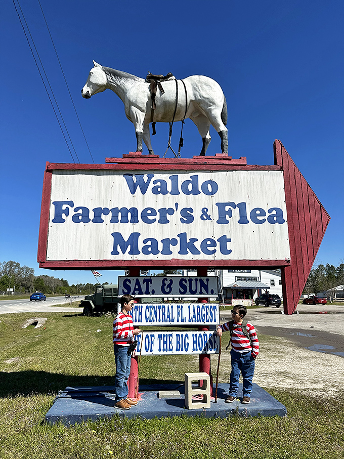 The legendary white horse sign stands as Waldo's unofficial mascot, guiding bargain hunters to "North Central FL's Largest" weekend adventure.