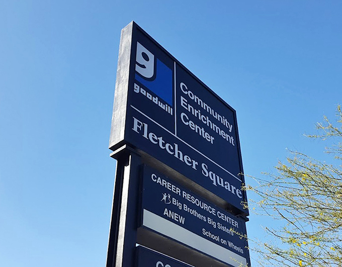 Not just a sign, but a beacon for bargain seekers. The blue Goodwill logo: California's unofficial symbol for "potential treasures ahead."