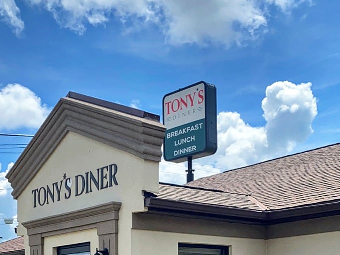 The sign stands tall against the blue sky, like a lighthouse guiding hungry travelers safely to shore. Breakfast, lunch, dinner&mdash;the holy trinity of diner offerings.