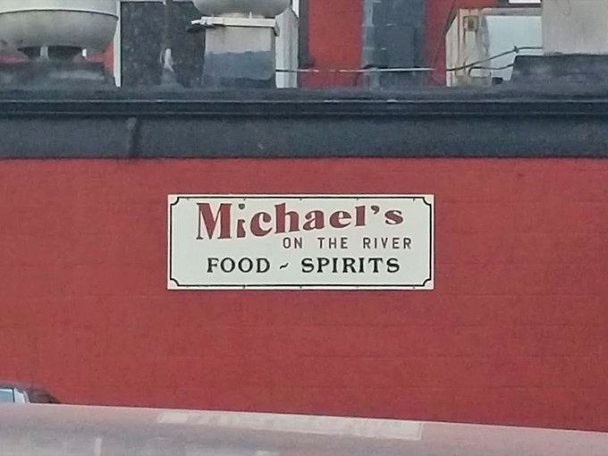 The sign says it all: "Food ~ Spirits" – a straightforward promise that Michael's delivers on with zero pretension and maximum flavor.