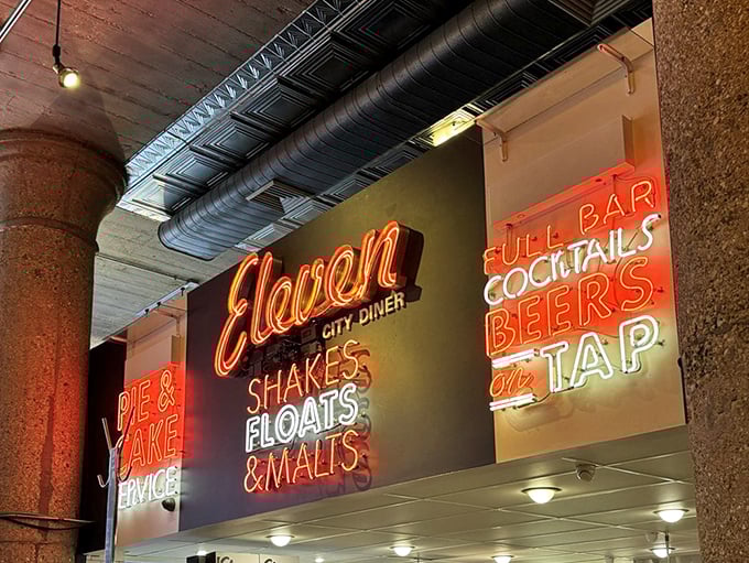 Neon signs illuminate promises of "SHAKES, FLOATS & MALTS" like Broadway marquees for your stomach. The best kind of bright lights.