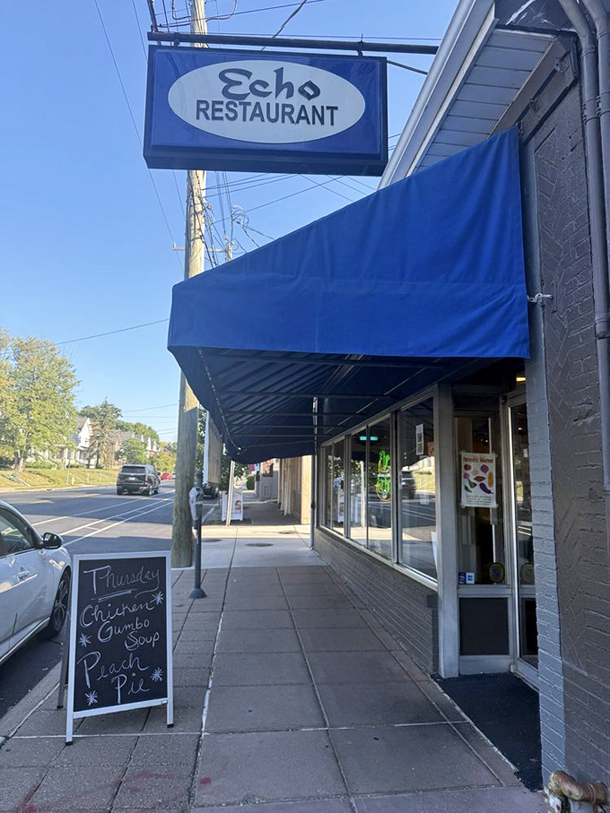 The blue awning and sidewalk signboard announce daily specials like town criers for the hungry masses of Cincinnati.