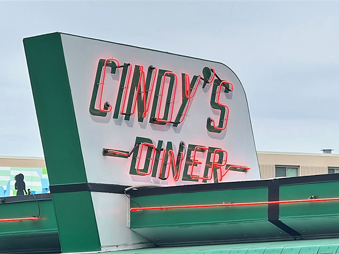 That neon sign glows like a beacon for the breakfast-deprived. In the early morning light, it's the North Star for hungry travelers.
