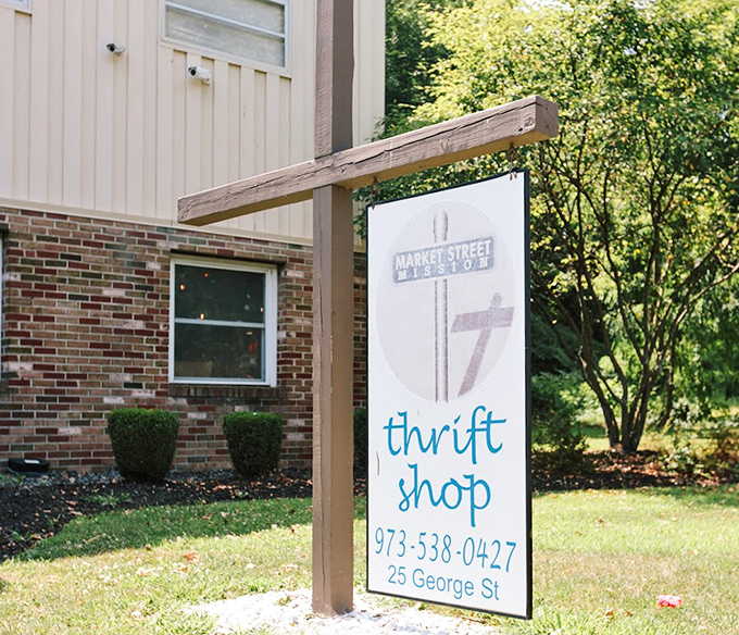 The welcoming sign that promises thrifting adventures at 25 George Street&mdash;like a treasure map where X marks the bargain.