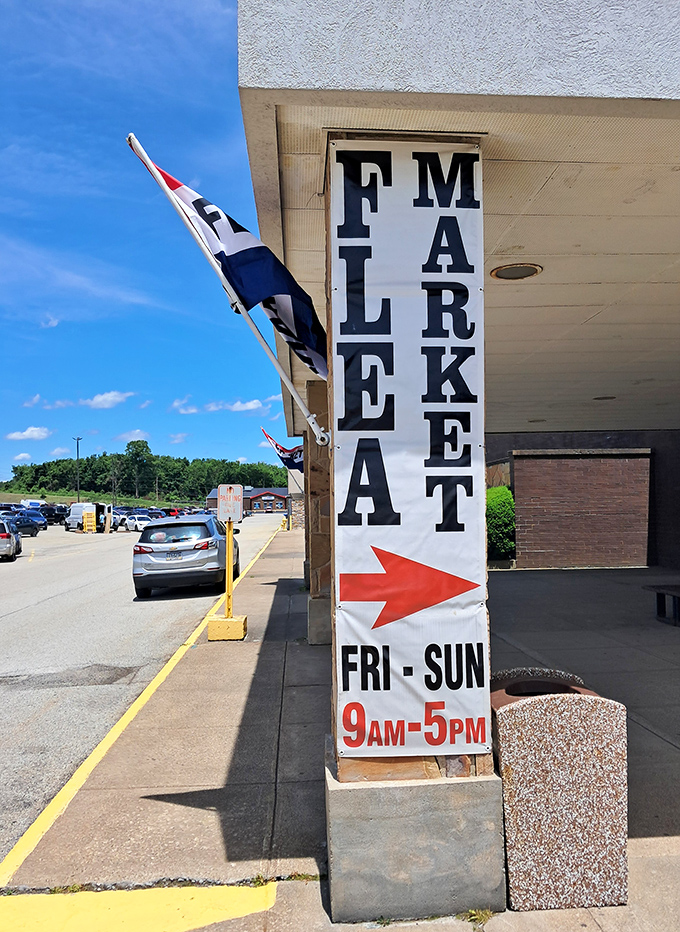 The unmistakable banner announces "FLEA MARKET" with an arrow, as if anyone needs directions to follow their bargain-hunting instincts.