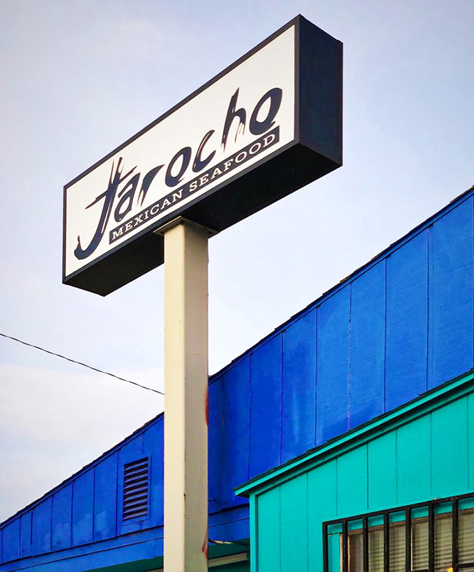 That sign isn't just announcing a restaurant—it's signaling a seafood sanctuary in the most unlikely of locations.