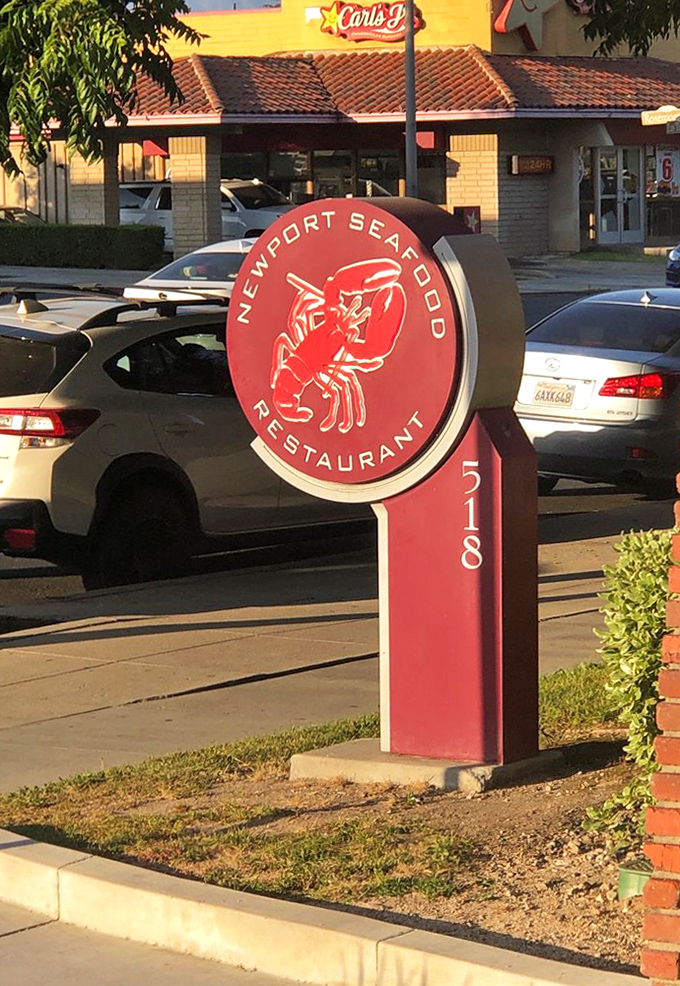 The iconic red lobster sign stands like a beacon for the hungry and knowing&mdash;a culinary lighthouse guiding seafood lovers safely to shore.