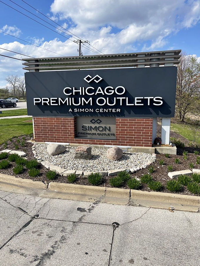 The entrance sign stands as a beacon of hope for fashion-forward shoppers with real-world budgets.