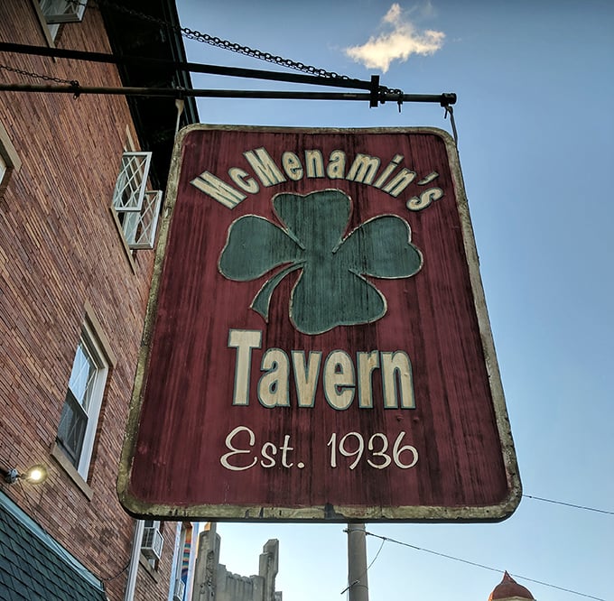 The hanging sign serves as a beacon of hope for the hungry and thirsty, like a lighthouse guiding ships to safe harbor.