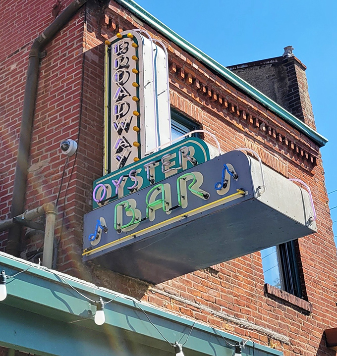 That vintage neon sign glows brighter at night, transforming from simple signage to a siren song for those seeking authentic flavors.