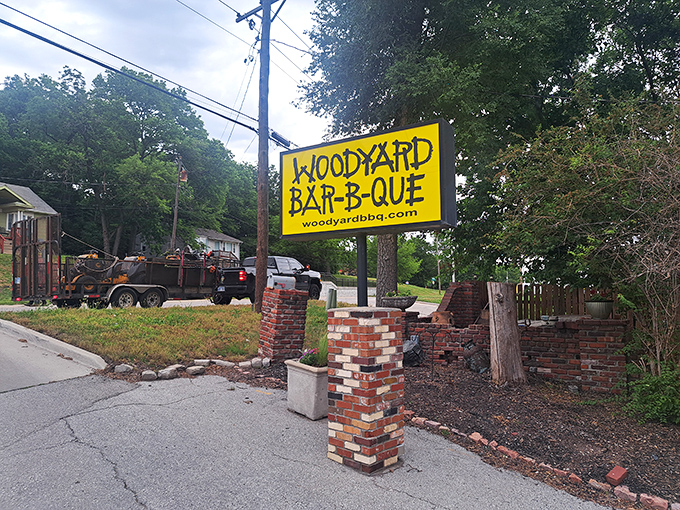 The sign says it all: simple, bold, and promising authentic barbecue experiences. No fancy script needed when your meat speaks for itself.