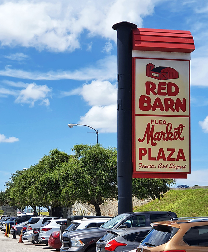 Standing tall against Florida's blue sky, the iconic Red Barn sign welcomes bargain hunters and curiosity seekers alike. The treasure hunt begins here.