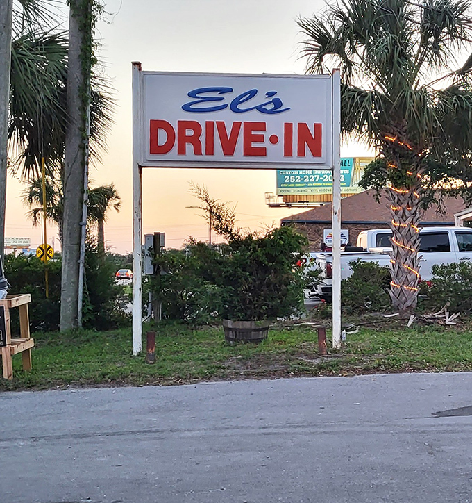 The El's Drive-In sign against a Carolina sunset&mdash;a beacon of hope for hungry travelers and a landmark that says, "You've arrived at the good stuff."
