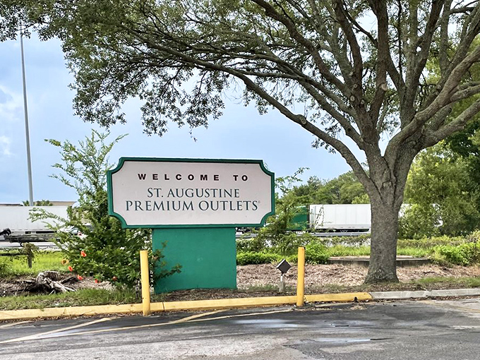 The welcome sign stands as the starting line for what will inevitably become a retail marathon requiring strategy, stamina, and comfortable shoes.