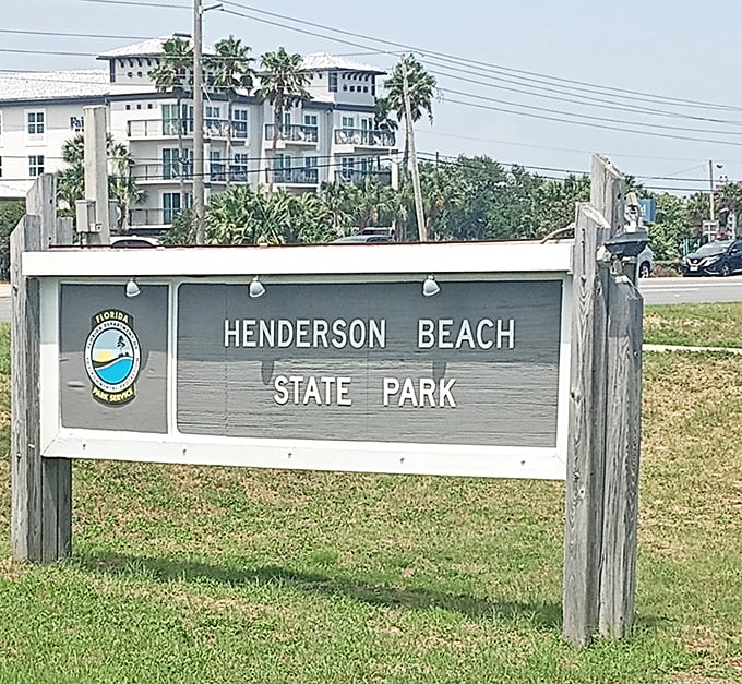 The sign that signals your vacation has officially begun. Henderson Beach: where your blood pressure drops with every step past this marker.