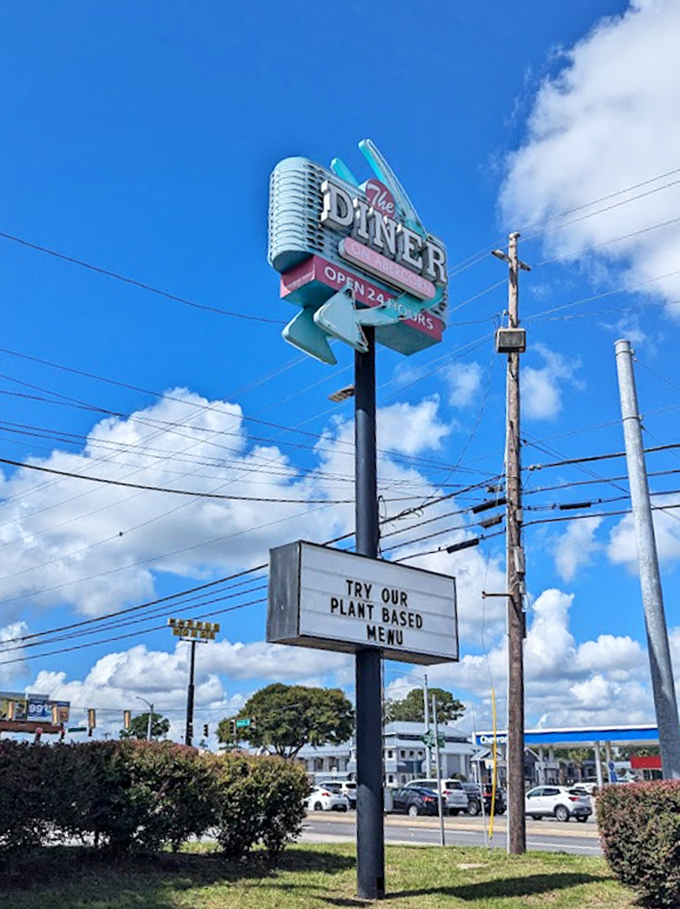 The Palace Diner sign stands tall against Savannah skies, a beacon of hope for the hungry and a landmark for the lost.