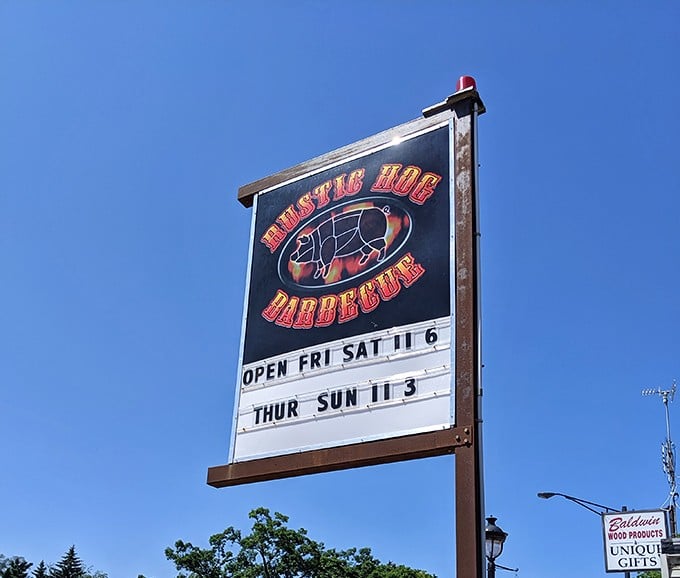 The beacon of barbecue beckons! This sign is the North Star for hungry travelers navigating northern Michigan's scenic byways.