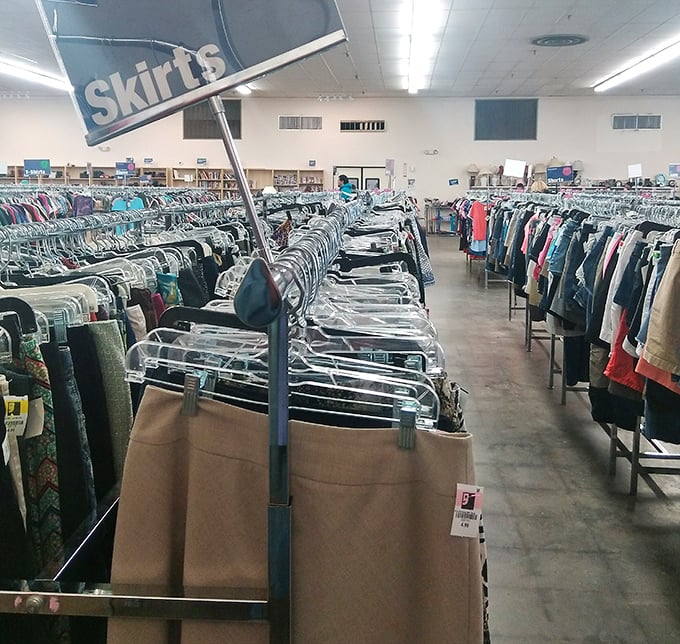 Skirts of every length, pattern, and era. Fashion history hanging on metal racks, waiting for its renaissance moment.