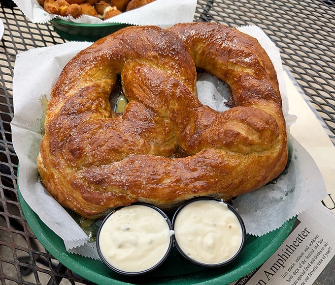 The humble pretzel reimagined as edible art—a twisted masterpiece of dough that's both substantial enough to satisfy and light enough to disappear quickly.