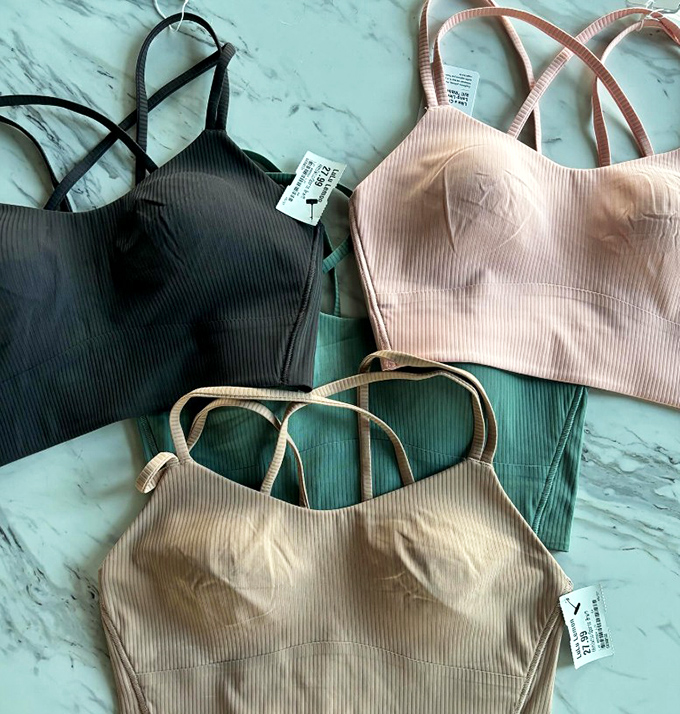 Ribbed athletic tops in earth tones that prove sustainable shopping and style aren't mutually exclusive. Second-life activewear ready for your first-place performance.