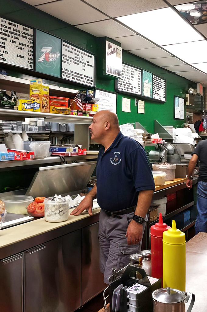 Kitchen staff orchestrating sandwich perfection with the practiced efficiency of people who've mastered their delicious craft completely.