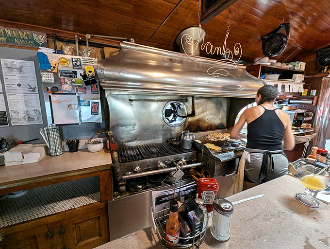 Where the magic happens. Frank's kitchen staff orchestrates breakfast symphonies on a well-seasoned grill that's seen decades of delicious duty.