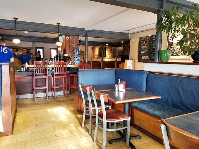 Where the magic happens. Blue banquettes and wooden chairs create the perfect backdrop for Vermont's breakfast theater, with servers as the supporting cast.