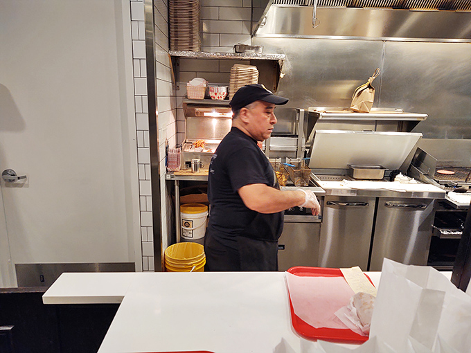 Behind the counter, culinary choreography unfolds as staff prepare the legendary sandwiches that have satisfied Chicagoans for generations.