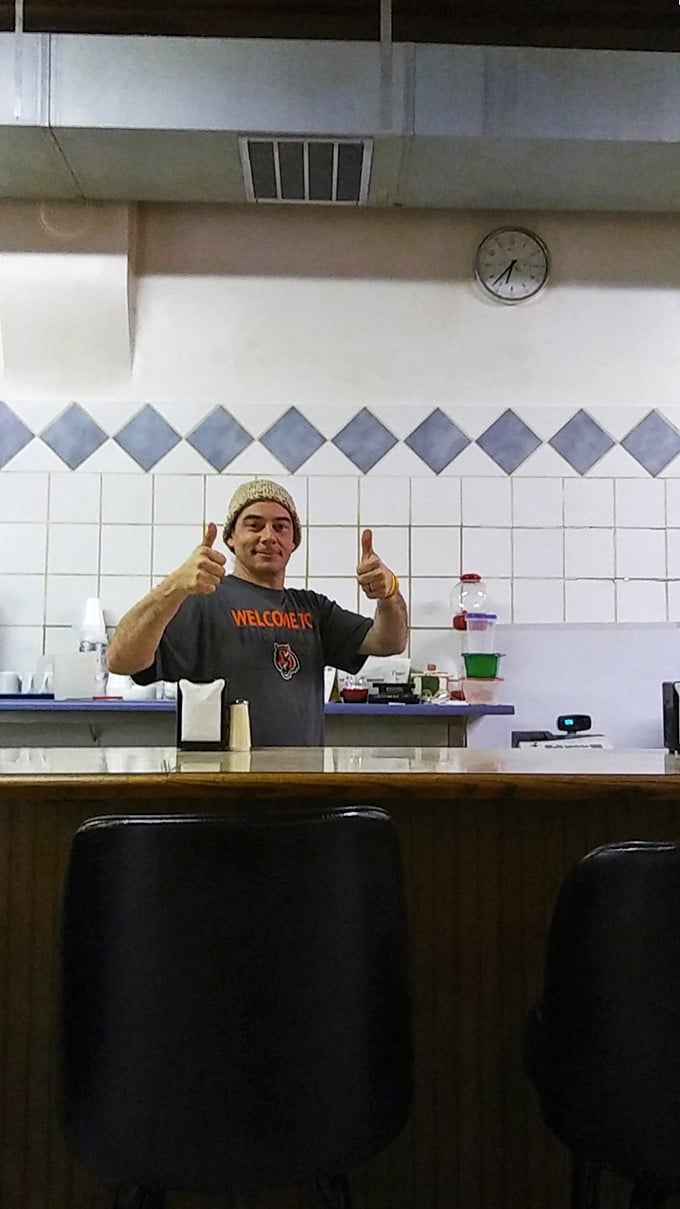 The universal thumbs-up&mdash;pizza's international language of approval. When your server looks this happy, you know you've chosen the right place.