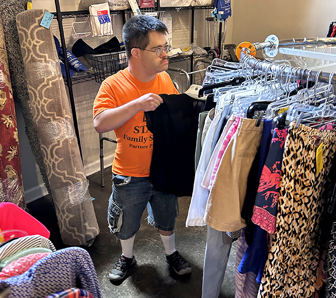 Staff members don the signature orange shirts with pride&mdash;thrift store superheroes whose powers include organization, curation, and community service.