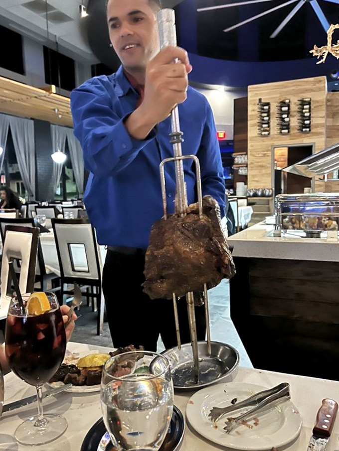 The tableside carving isn't just service&mdash;it's theater. That focused expression says, "I take your protein needs very seriously."