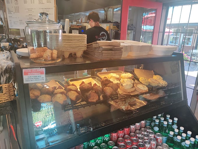 Behind the pastry case lies evidence that someone woke up way earlier than you to create these carbohydrate masterpieces. Respect the baker!