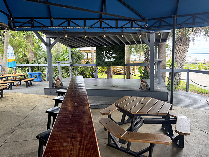 The stage area proves food isn't the only attraction. Live music and lake breezes create the soundtrack to memories you'll be humble-bragging about later.