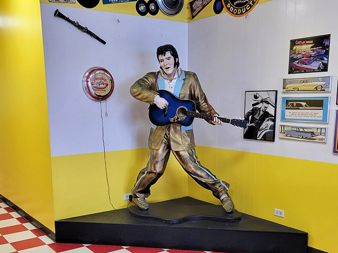 The King himself stands guard, eternally ready to serenade your hot dog feast. Blue suede shoes optional, hearty appetite mandatory.