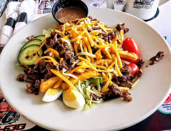 A chef's salad that defies the sad desk lunch stereotype – protein-packed, colorful, and large enough to feed a small hiking expedition.