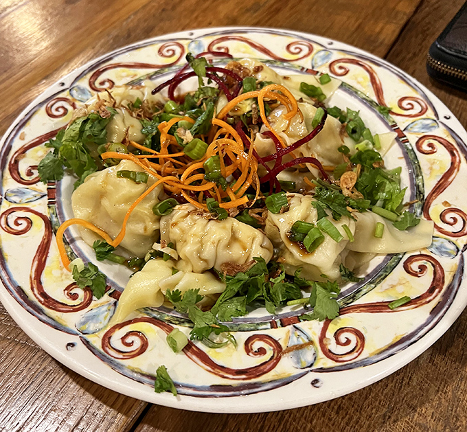 Dumplings so pretty they deserve their own Instagram account, garnished with herbs that aren't just for show&mdash;they're flavor bombs!