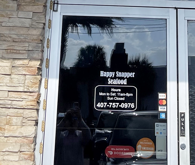 Store hours posted like a promise: "We'll be here when you need your seafood fix."