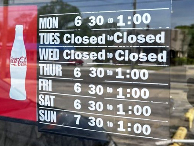 The hours sign reads like poetry to early risers&mdash;a schedule that respects the sanctity of breakfast and the importance of Tuesdays off.