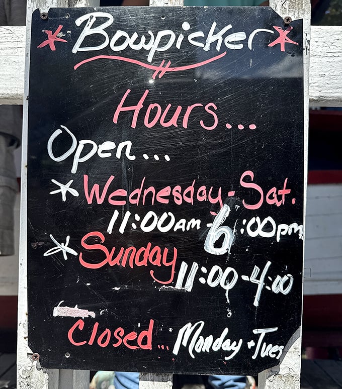 Operating hours written in chalk &ndash; old school and unapologetic. Plan accordingly or face the disappointment of an empty stomach.