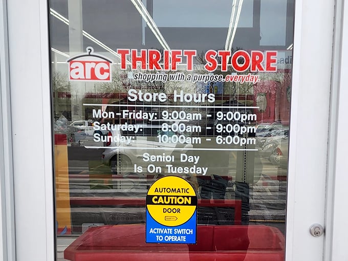 The store hours sign reminds shoppers of Tuesday's senior discount, when wisdom and savings come together for maximum thrift impact.