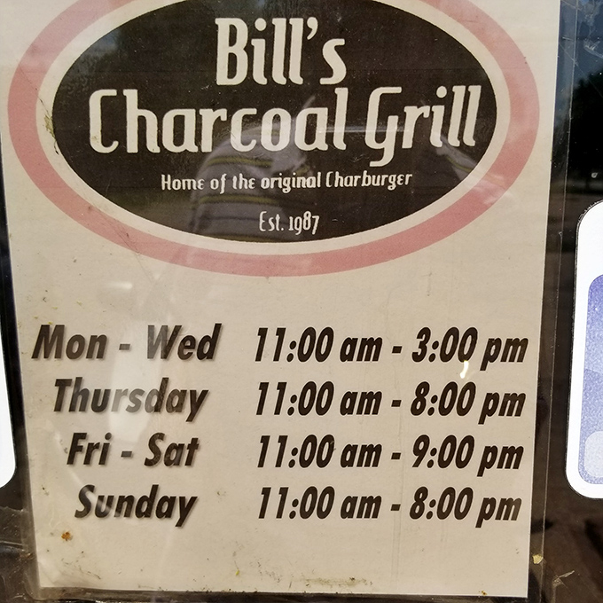 The hours sign reveals the rhythm of a local institution. Note Thursday's late closing&mdash;clearly burger night for those in the know.