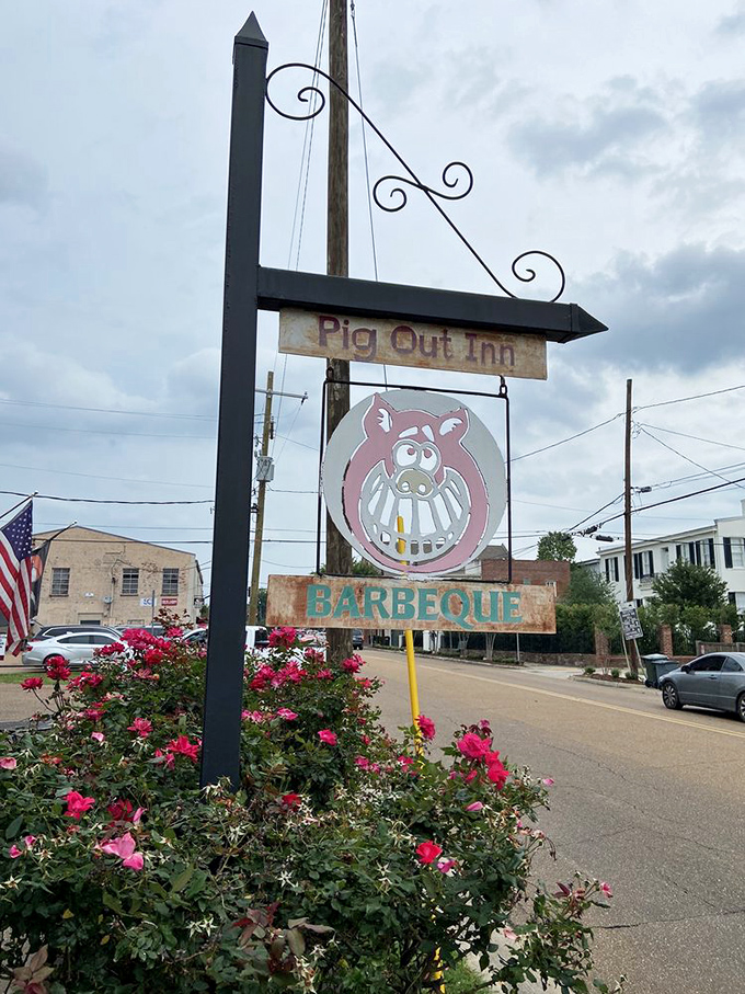 The roadside sign doesn't need fancy graphics or flashing lights&mdash;when your barbecue speaks this loudly, a simple pig logo is all you need.