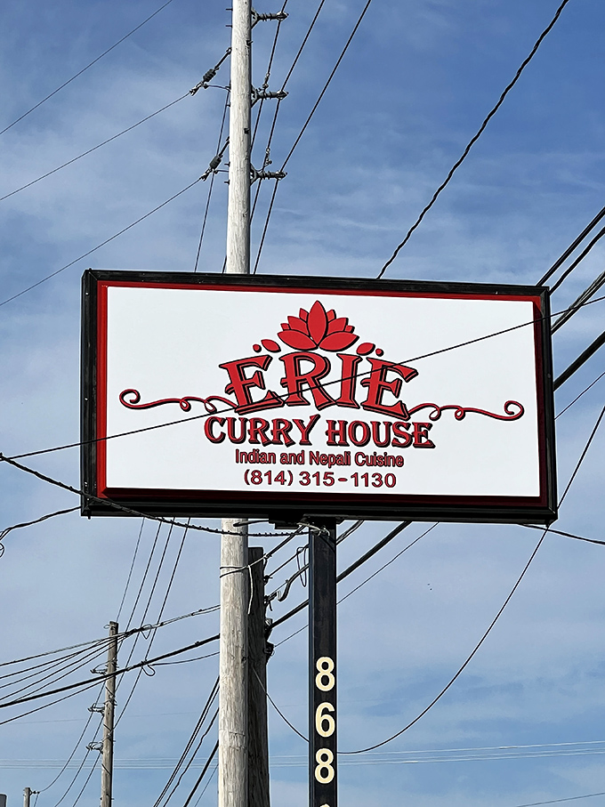 The roadside sign stands as a beacon for hungry travelers, promising authentic flavors in a sea of fast-food sameness.