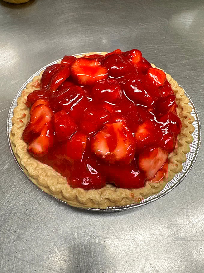 Strawberry pie so red and glossy it looks like summer captured under glass, waiting to make your day better.
