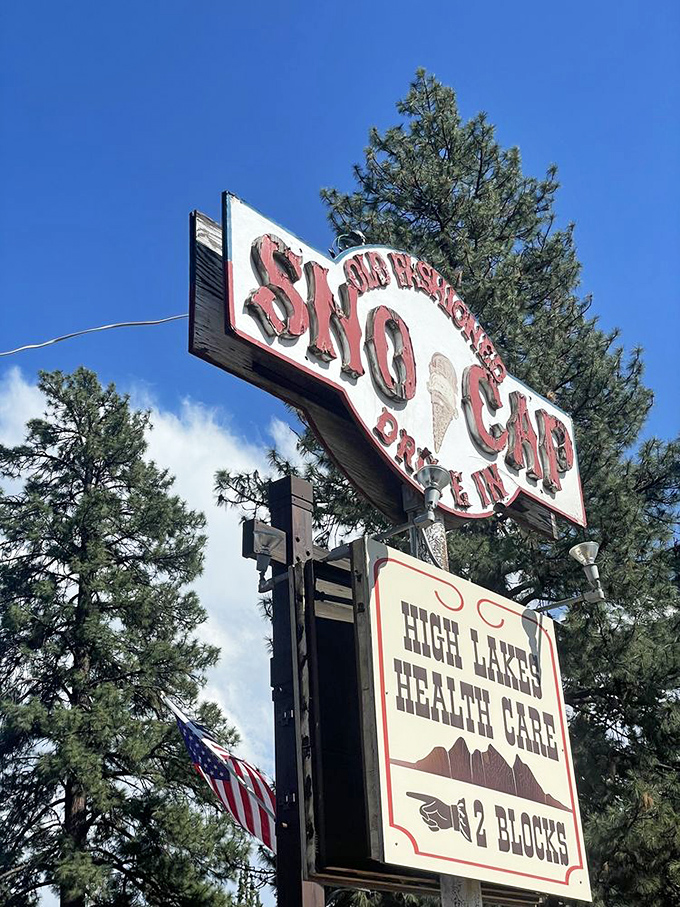 The vintage roadside sign stands as a beacon of hope for hungry travelers&mdash;promising salvation in the form of burgers and ice cream.
