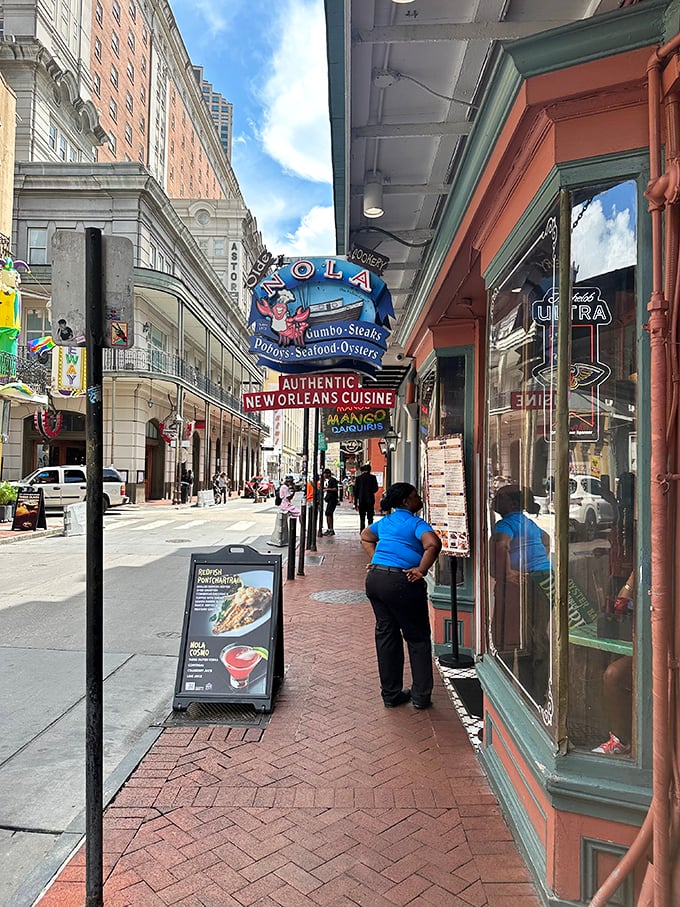 On Bourbon Street, this sidewalk view represents the calm before the delicious storm that awaits just beyond those doors.