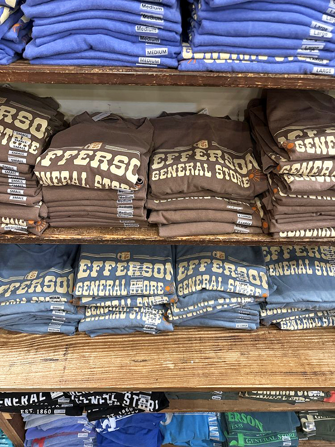 T-shirts stacked with precision aren't just souvenirs&mdash;they're wearable postcards. Each folded fabric rectangle says, "I discovered something authentic in Jefferson."
