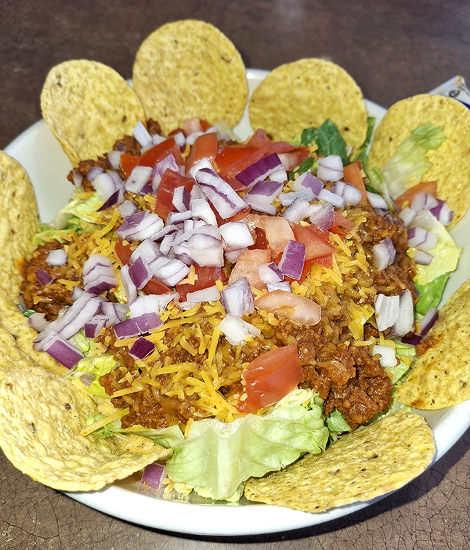 Taco salad served in its own edible bowl &ndash; a fiesta of flavors that proves this diner knows its way around more than just breakfast.