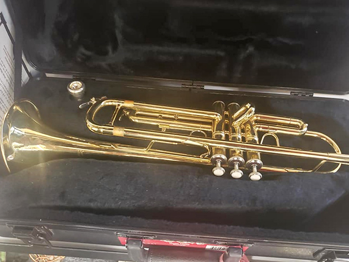 A gleaming brass trumpet awaits its next musical journey. Someone's abandoned band dream becomes your chance to finally learn that jazz solo.